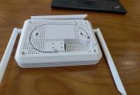 China Small Size WiFi6 ONU GPON Dual Band 3000Mbps 2.4G 5G AX3000 4GE RJ11 USB for sale