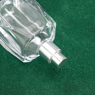 China Transparent 50ml Square Cut Glass Perfume Bottle with Bayonet Spray Cap for sale