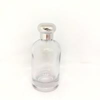 China 100ml Glass Perfume Bottle with Zamac Plastic Cap Empty Spray Bottle for Perfume Packaging for sale