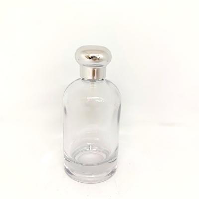 China 100ml Glass Perfume Bottle with Zamac Plastic Cap Empty Spray Bottle for Perfume Packaging for sale