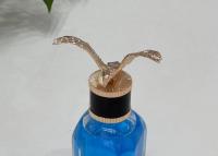 China Custom Eagle-Shaped Zamak Perfume Cap Zinc Alloy Bottle Lid Gold Silver Rose Gold for sale