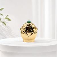 China Sculpted Flower Rose Zinc Alloy Perfume Cap Green Rhinestone Top Golden Parfum Bottle Top Custom Logo for sale