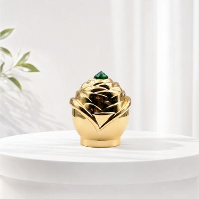 China Sculpted Flower Rose Zinc Alloy Perfume Cap Green Rhinestone Top Golden Parfum Bottle Top Custom Logo for sale
