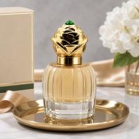 China Sculpted Flower Rose Zinc Alloy Perfume Cap Green Rhinestone Top Golden Parfum Bottle Top Custom Logo for sale