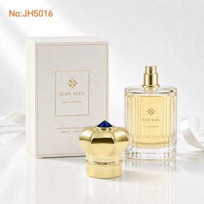 China Hot Selling Dubai Saudi Luxury Mirror Gold 8 Petal Crown Zamac Perfume Cap JH5016 Single Sapphire Blue Crystal Smooth Royal Metal Oud Attar Bottle Cover Custom Engraved Logo for sale