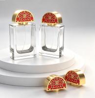 China Semicircle Hollow Floral Zamac Perfume Cap with Red Enamel Gold Plated Finish and Custom Logo Engraving for sale