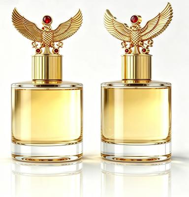 China Magnetic Eagle Wing Perfume Cap with Red Rhinestone Gold Plated Bottle Lid for sale