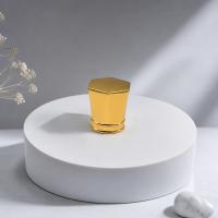 China Luxury Hexagonal Zinc Alloy Perfume Cap Bright Gold Electroplated Zamac Fragrance Bottle Lid Custom Logo OEM Metal Perfume Cover for sale