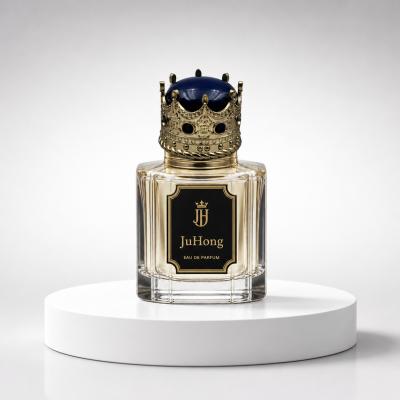 China Crown Embossed Zamac Zinc Alloy Perfume Cap with Resin Top and Customizable Design for sale