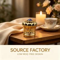 China Crown Shape Zinc Alloy Perfume Cap Luxury Gold Plated Perfume Bottle Lid With Blue Diamond Decoration Custom Logo For Cosmetic Glass Bottle Magnetic for sale
