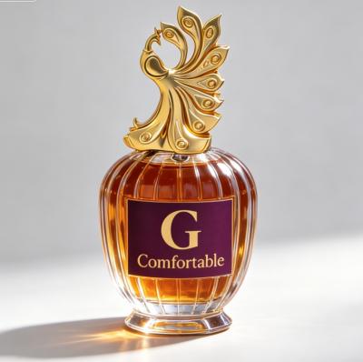 China Luxury Vertical Ribbed Clear Glass Perfume Bottle With Golden Peacock Shape Zamac Cap, Oval Empty Fragrance Spray Bottle, Custom Logo Glass Perfume Container For High‑End Perfume Packaging for sale