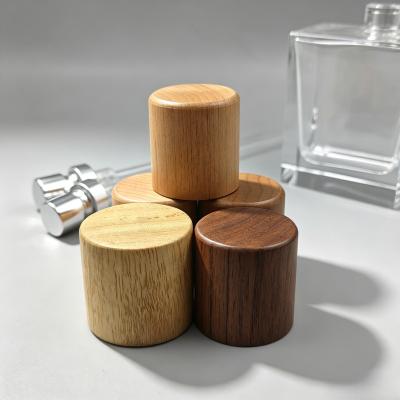 China Cylindrical Wooden Bottle Cap Custom Engraved Logo Natural Wood Lid For Perfume Cosmetic Bottle OEM Wholesale for sale