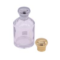 China Zinc Alloy Custom Zamak Perfume Caps 23x31mm High End Resealable Bottle Caps for sale