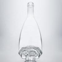 China Custom Logo Unique Floral Bottom Super Flint Long Neck 750ml Glass Bottle for Gin Cork for sale