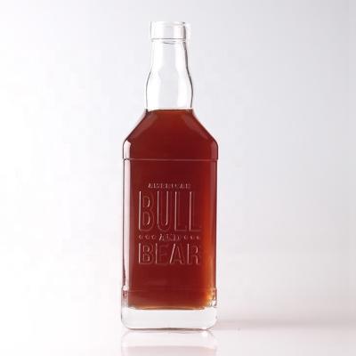 China Collar Material Glass 500ml 700ml Embossed Transparent Bottle for Whisky Rum Gin Brandy for sale