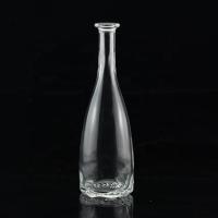 China Acid Etch Surface Handling Tequila Glass Bottles with Round Neck and Empty Flint for sale