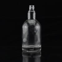 China Acid Etch Surface Handling Tequila Glass Bottles with Round Neck and Empty Flint for sale