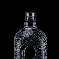 China Glass Round Carved 700ml 750ml Vodka Glass Bottle Wine Bottle With Cork Sealing Type for sale