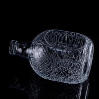 China Glass Round Carved 700ml 750ml Vodka Glass Bottle Wine Bottle With Cork Sealing Type for sale