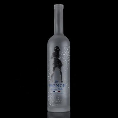 China Classic Shape 700ml 750ml Frosted Applique Vodka Glass Bottle for Beverage Packaging for sale