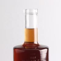 China Engraved Tequila Glass Bottle at 750ml 1 Liter with Round Shape and Cork Sealing Type for sale