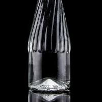 China Glass Body Material 500ml 700ml Whiskey Wine Bottle with Unique Bottom Raised Design for sale