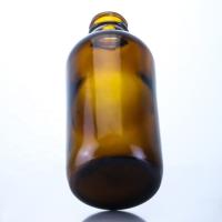 China 350ml Empty Glass Beer Bottle with Crown Cap Silk Screen and Hot Stamping Unique Design for sale