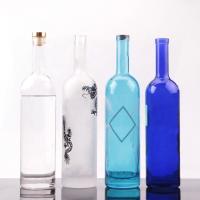China 750ml Round Shape Glass Vodka Bottle with Cork Cap and Customized Surface Handing for sale