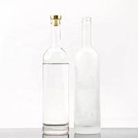 China 750ml Round Shape Glass Vodka Bottle with Cork Cap and Customized Surface Handing for sale