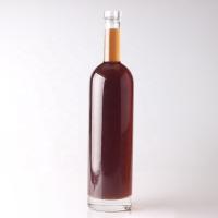 China 750ml Round Shape Glass Vodka Bottle with Cork Cap and Customized Surface Handing for sale