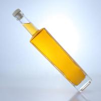 China 700ml High Flint Round Shape Liquor Glass Bottle with Custom Logo and Cork Top Finish for sale