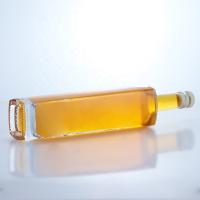 China 700ml High Flint Round Shape Liquor Glass Bottle with Custom Logo and Cork Top Finish for sale