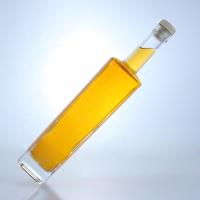 China 700ml High Flint Round Shape Liquor Glass Bottle with Custom Logo and Cork Top Finish for sale