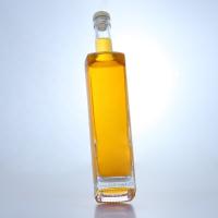 China 700ml High Flint Round Shape Liquor Glass Bottle with Custom Logo and Cork Top Finish for sale