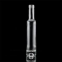 China 750ml Heavy-based Clear Glass Alcohol Bottle with Golden Metal Cap in Bulk for sale