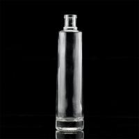 China 750ml Heavy-based Clear Glass Alcohol Bottle with Golden Metal Cap in Bulk for sale