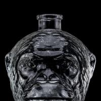 China Unique Design 500ml 750ml Monkey Head Shaped Glass Bottle for Vodka Liquor With Cork for sale