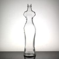 China Sexy Female Body Shaped Bottle Unique Glass Liquor Bottle With Crown Cap for sale