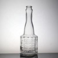China Customized Surface Handing Football Shaped Glass Bottle for Unique Alcohol Beverage for sale