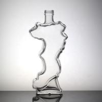 China Customized Surface Handing Football Shaped Glass Bottle for Unique Alcohol Beverage for sale
