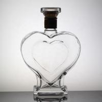 China Customized Surface Handing Football Shaped Glass Bottle for Unique Alcohol Beverage for sale