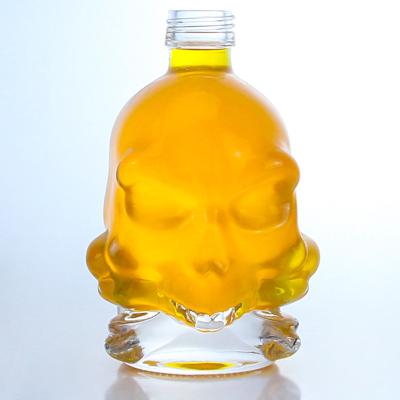China Decal Surface Skull Shape Glass Liquor Bottle for Whisky Vodka Brandy Aging Technique for sale