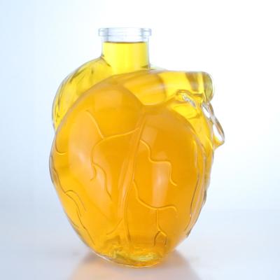 China Clear or Customized Heart Shape Glass Liquor Bottle for Beverage Whisky Vodka Brandy for sale