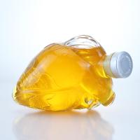 China Clear or Customized Heart Shape Glass Liquor Bottle for Beverage Whisky Vodka Brandy for sale