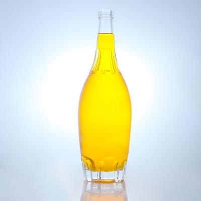 China Customization Round Shape Liquor Bottle with Embossed Design and Customized Cork Cap for sale