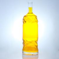 China Liquor Glass Bottle with Embossed Customizable Logo and Clear or Customized Bottle Color for sale