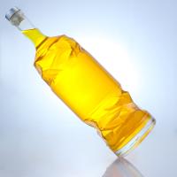 China Liquor Glass Bottle with Embossed Customizable Logo and Clear or Customized Bottle Color for sale