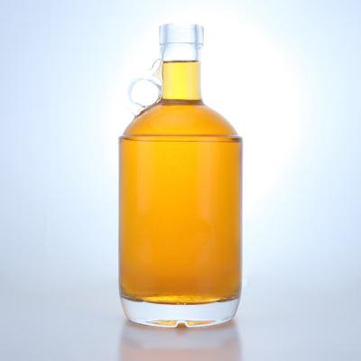 China 750ml Glass Spirits Bottle for Vodka Rum Tequila Featuring Ring Handle at Neck and Cork Top for sale