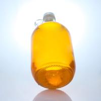 China Customized Logo Round Shape Liquor Glass Bottle with Handle and Screw Cap for sale