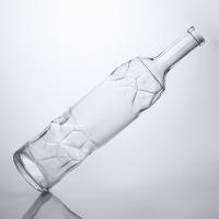 China Highly Durable Liquor Glass Bottle with Embossed Pattern and Cork Stopper Perfect for sale